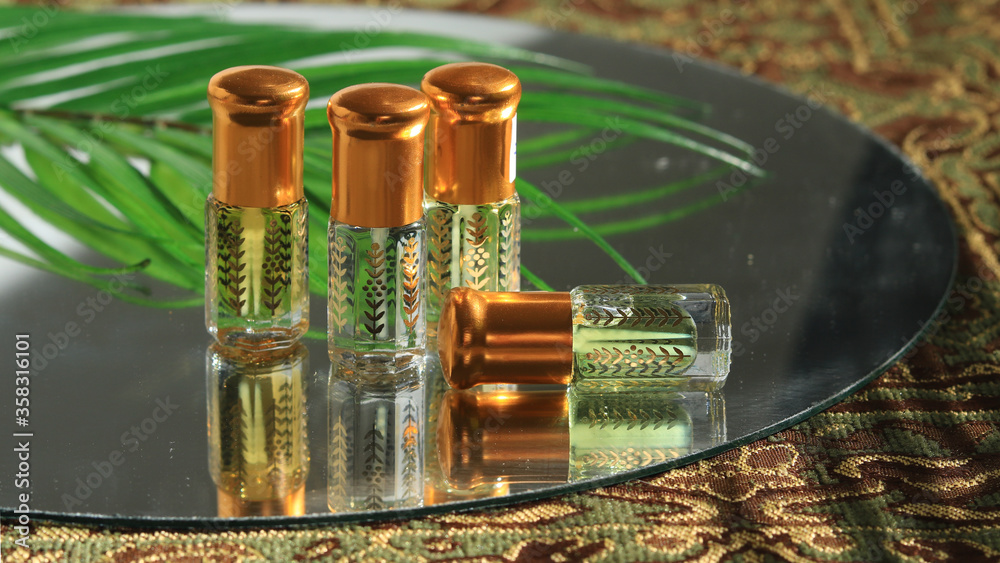 Arabian oud attar perfume in mini bottles. Stock Photo | Adobe Stock