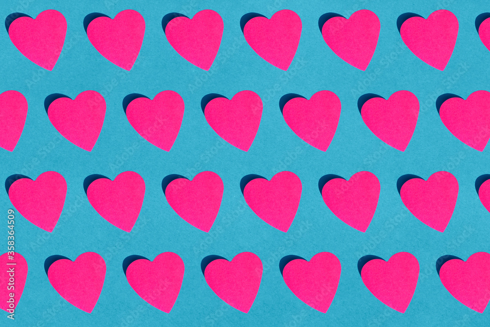 Seamless pattern of pink paper hearts against blue background Stock ...