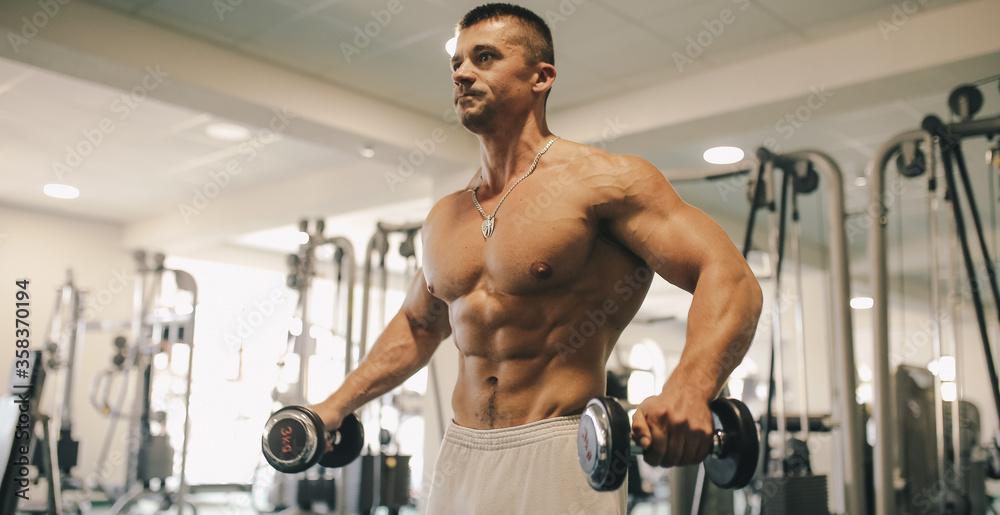 Strong, adult, fit muscular caucasian man coach posing for a photoshoot ...