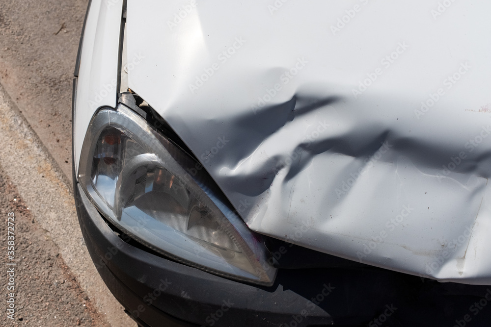 car after an accident. damage to the hood with headlight Stock Photo ...