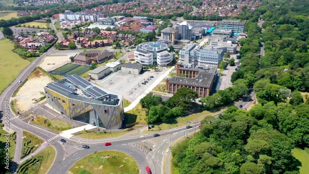 Aerial footage of the Bournemouth University, Talbot Campus buildings ...