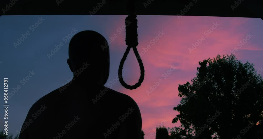 Man Trying to Commit Suicide by Hanging Himself on a Hangman Rope Changing his Mind and Leaving ...