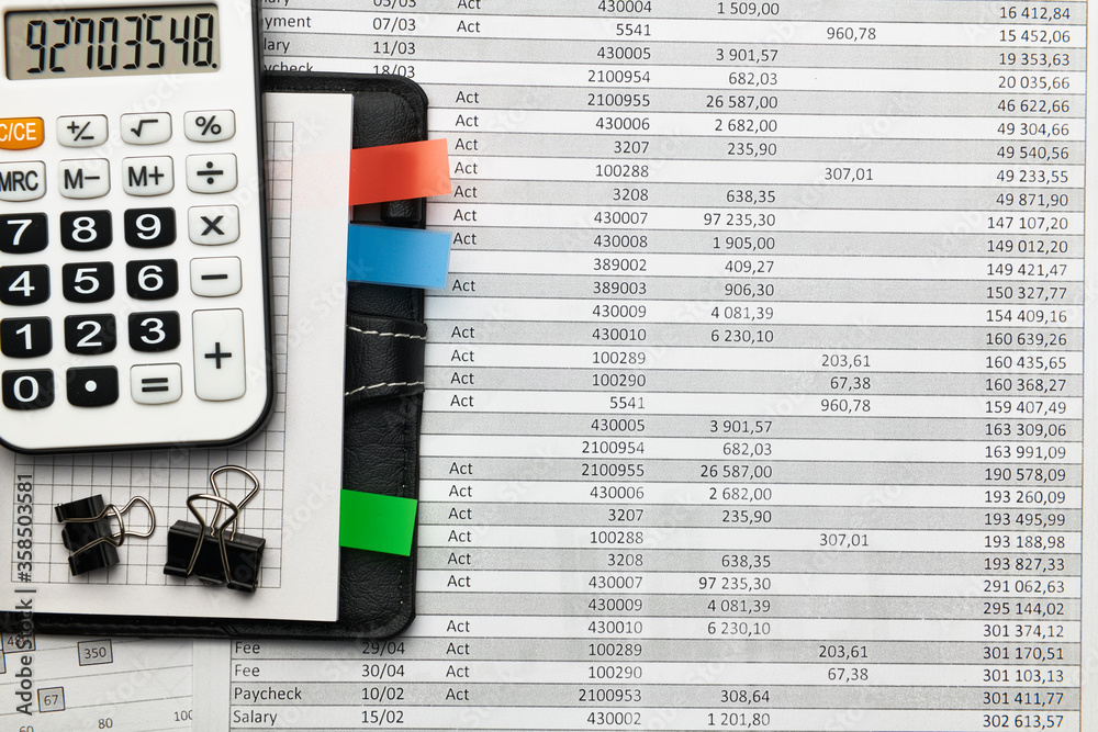 Top view of office employee's desk - work with financial reports ...