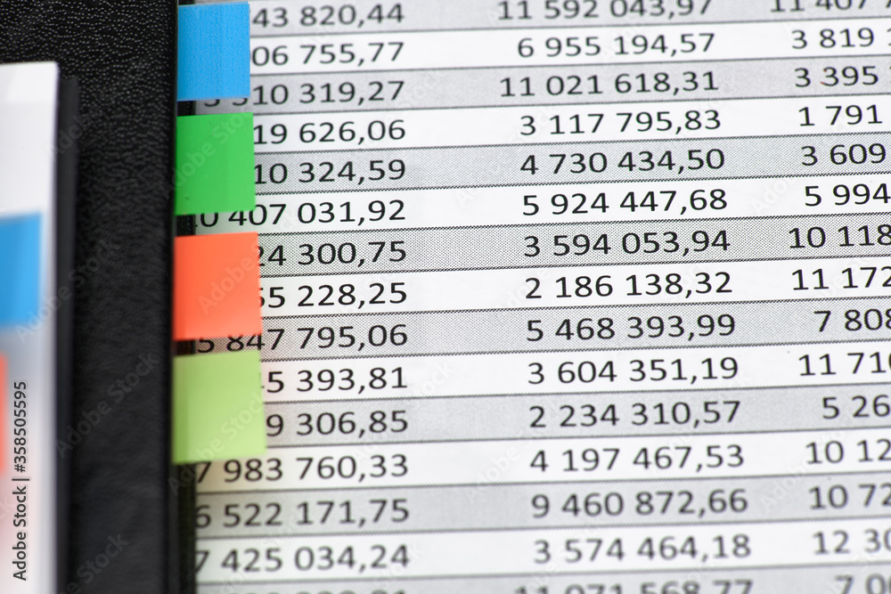 Top view of office employee's desk - work with financial reports ...