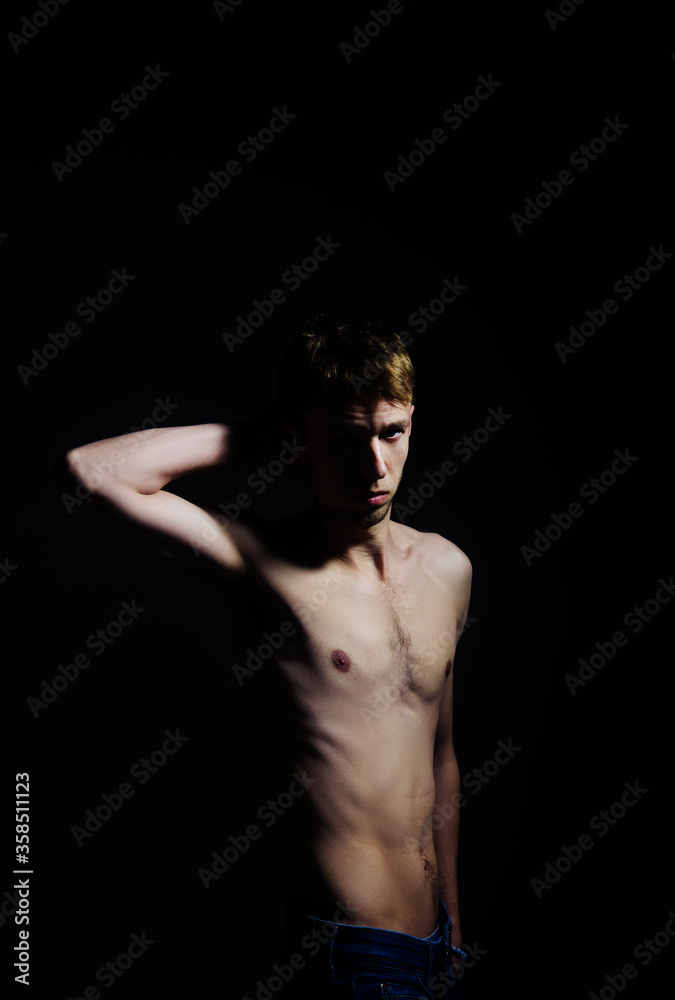 Skinny young man posing fashion, anorexic look, slim body. Stock Photo ...