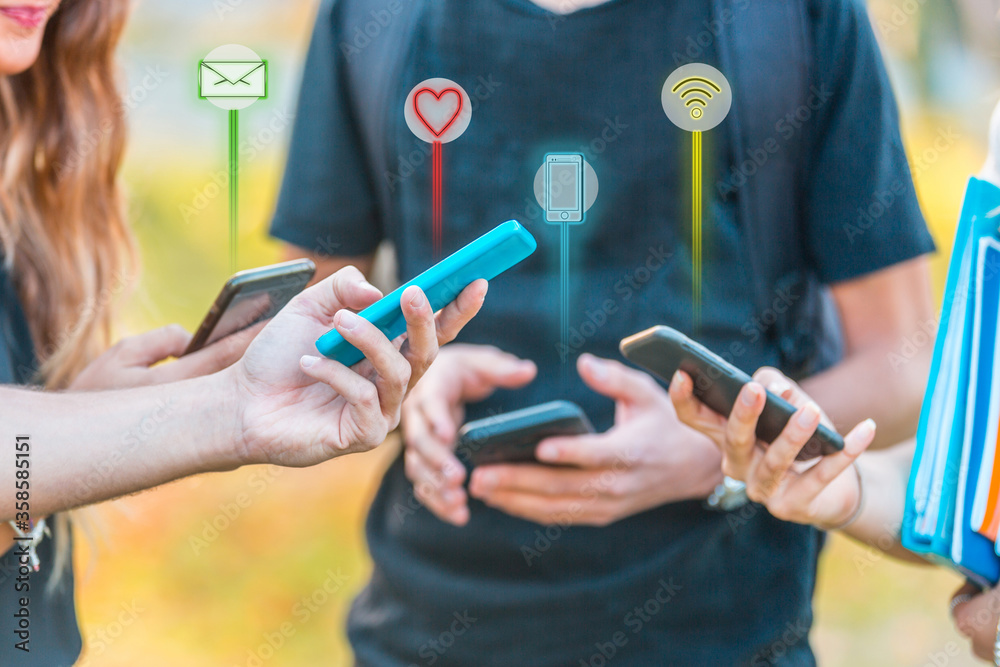 Generation Z friends using smartphones, icons popping out from screens ...