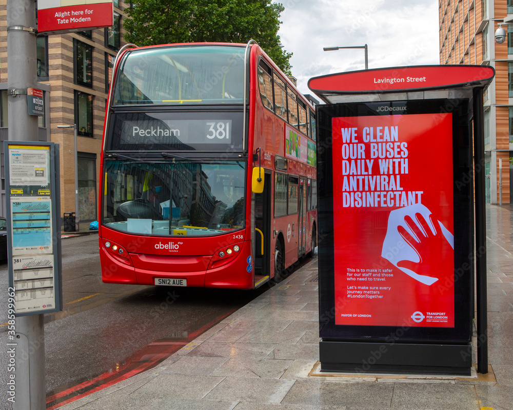London Bus at a Bus Stop Displaying a Coronavirus Sign Stock Photo ...