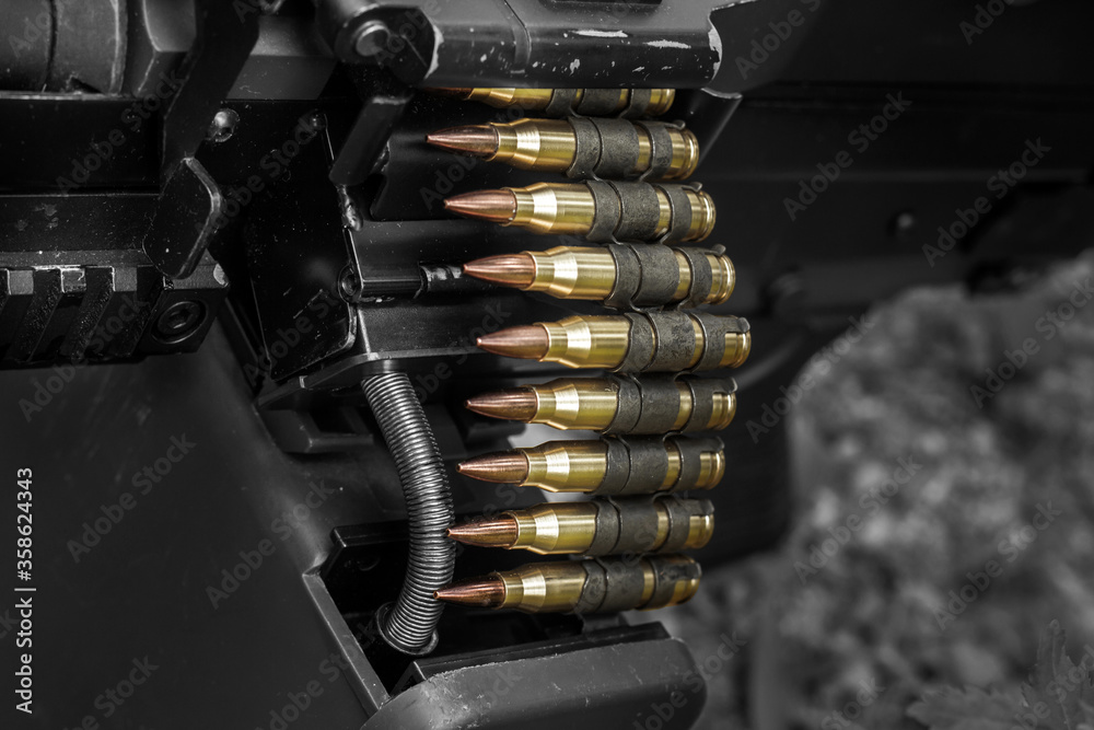 M249 light machine gun with 7.62 mm cartridge belt black and white ...