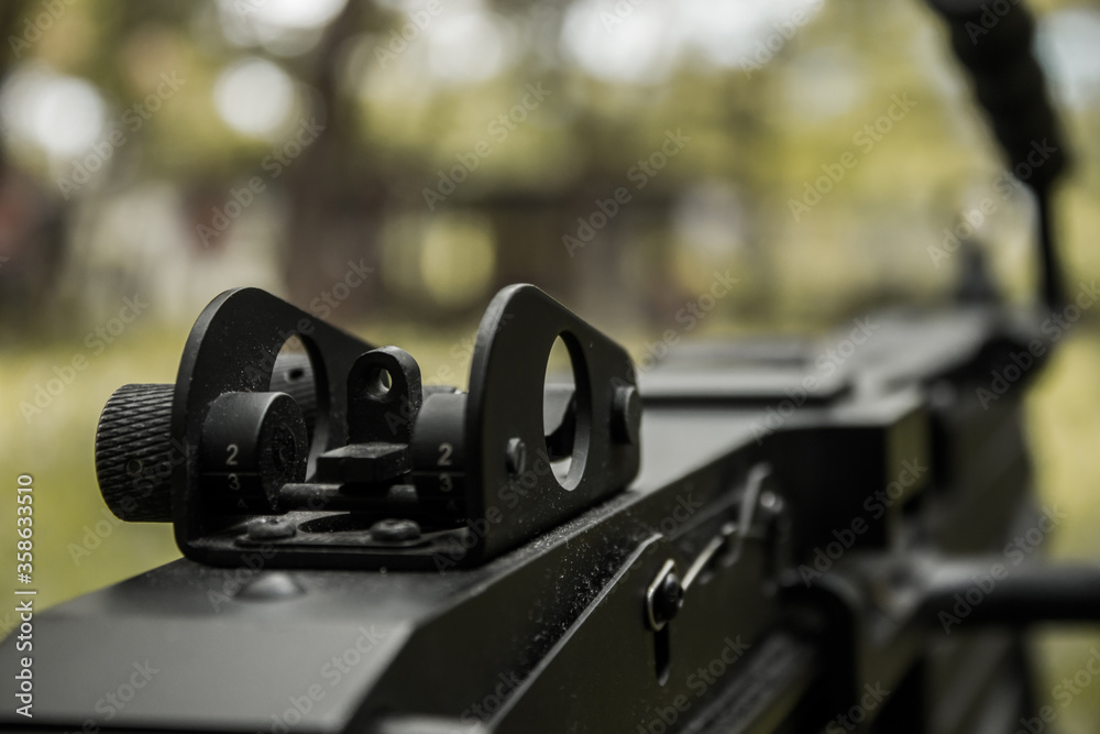Rear sight of M249 light machine gun with 7.62 mm cartridge belt Stock ...