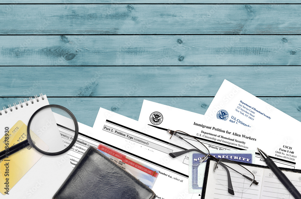 USCIS form I-140 Immigrant petition for alien workers lies on flat lay ...