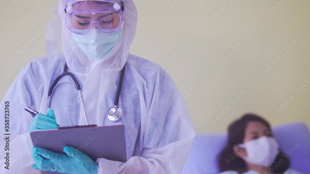 The doctors are examining the Asian female patient Who lay down on ...
