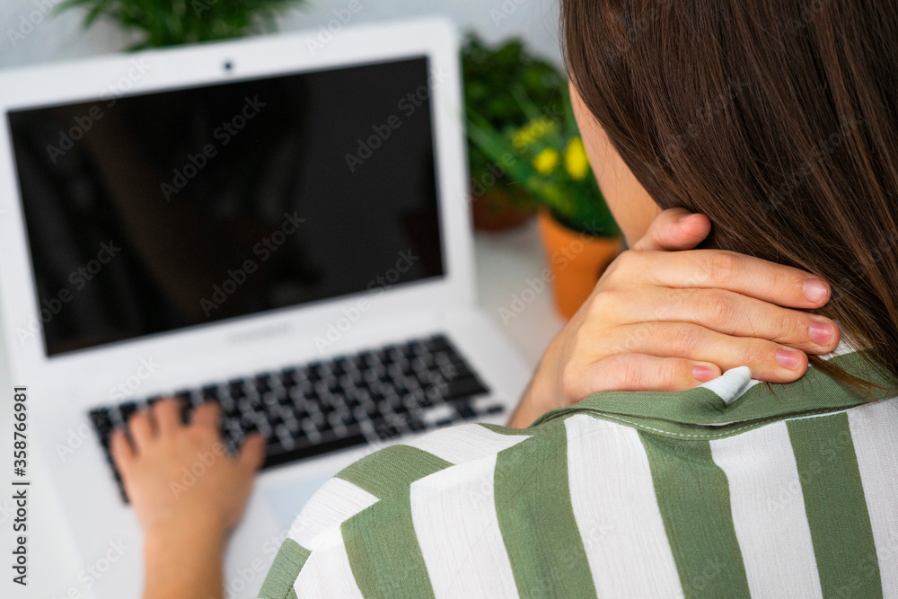 Office worker woman with neck pain. Neck pain concept at work ...