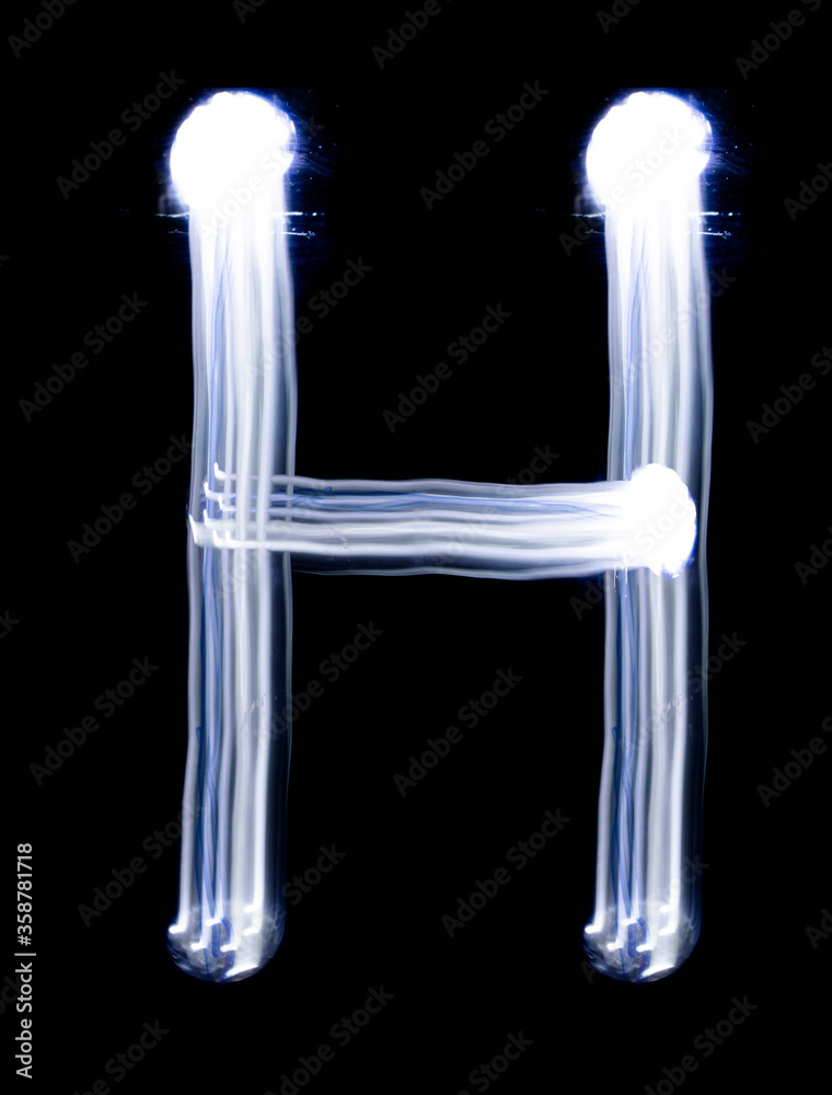 Handwrite letter H, made with light painting technic isolated on black ...