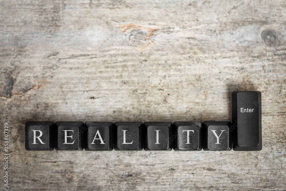 Key buttons with letters, word reality and enter, concept myth and real ...