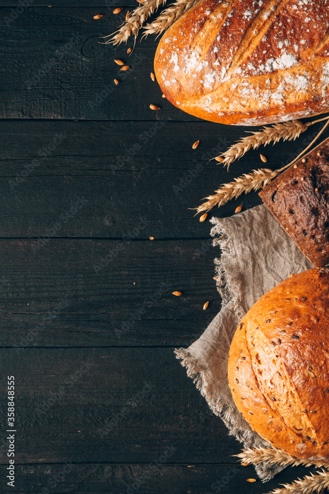 Bread border on wood background with copy space. Vertical composition ...