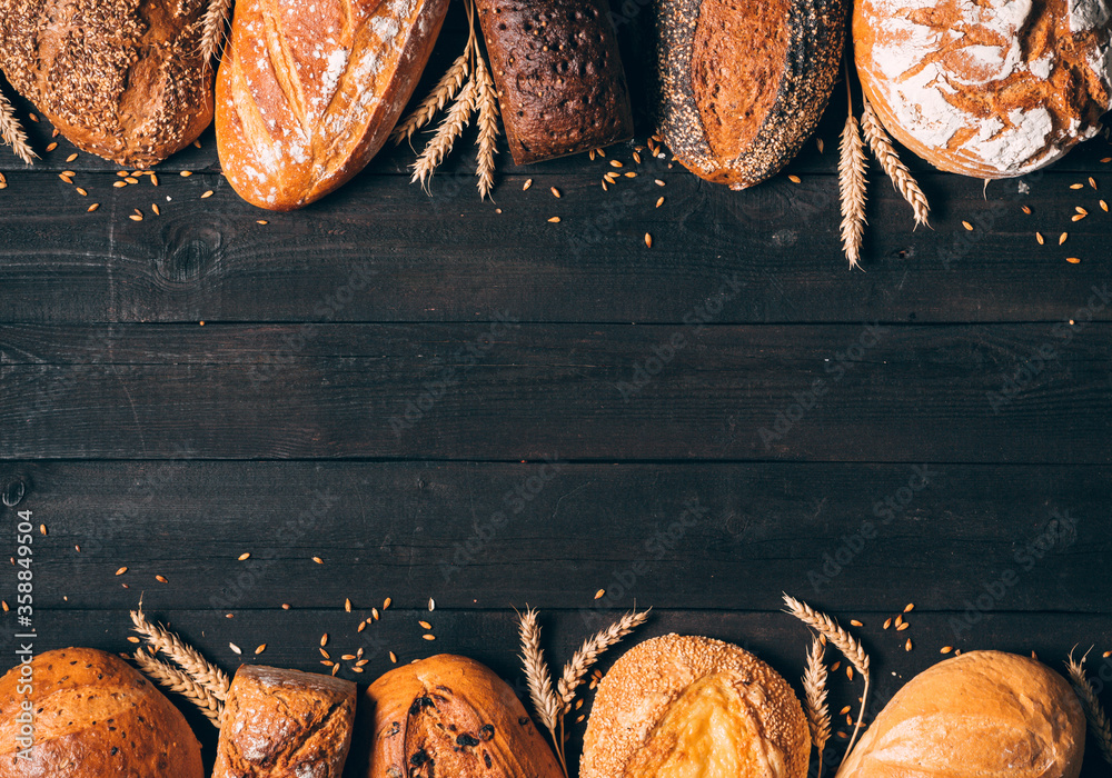 Bread border on wood background with copy space. Vertical composition ...