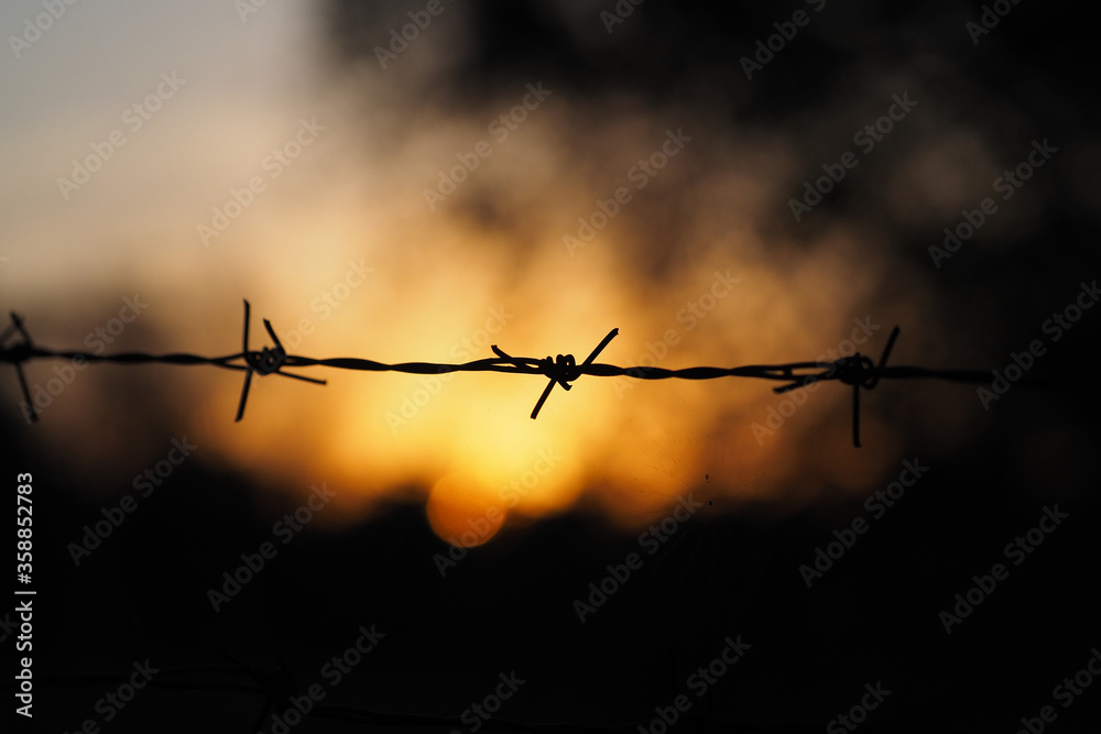 Sunset Behind The Barbed Wire.. Stock Photo | Adobe Stock