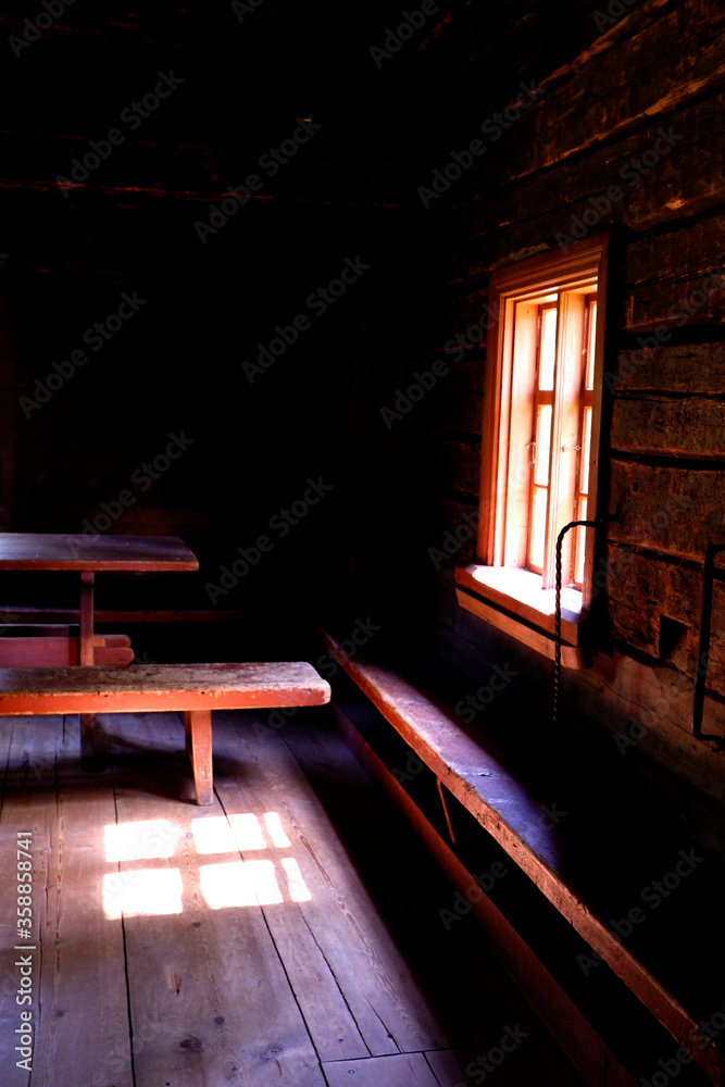 Window in the old wooden house with light coming through it ...