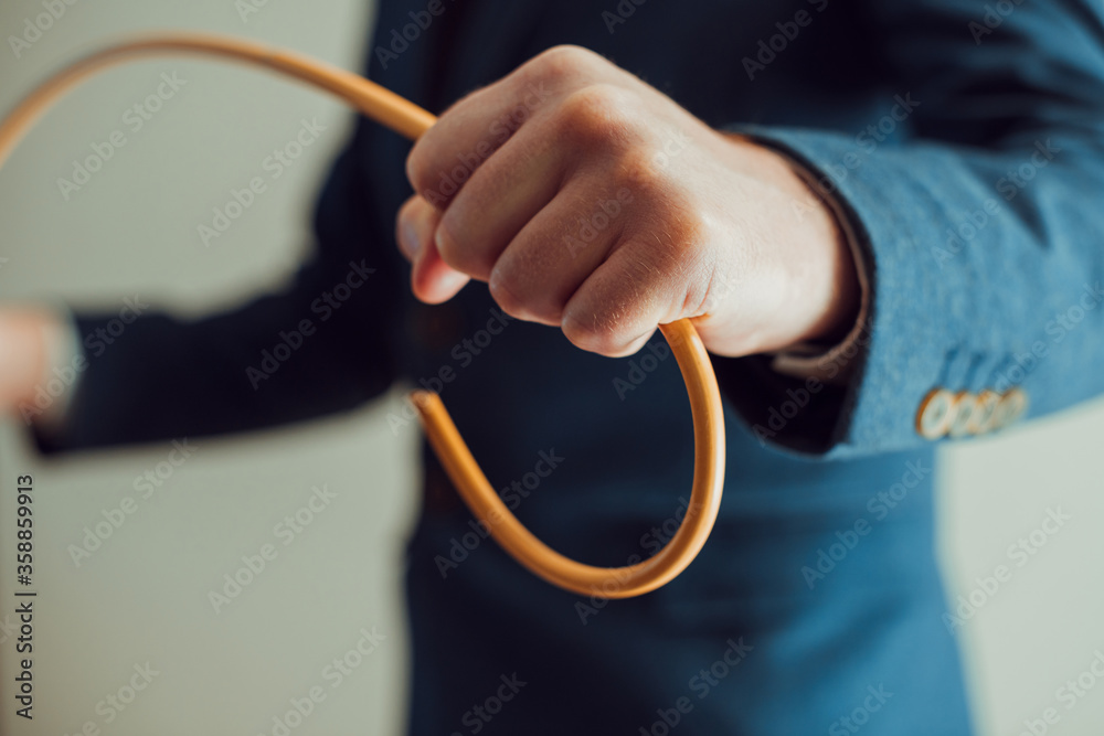 Headmaster with cane. Strict man teacher with crooked rattan cane ...