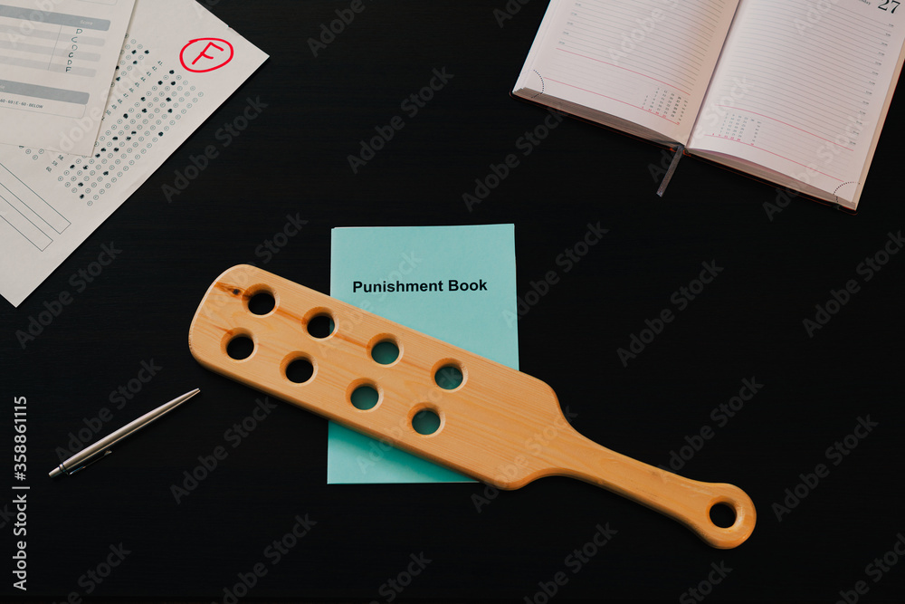 Punishment book. Wooden paddle for spanking on headmaster's or teacher ...