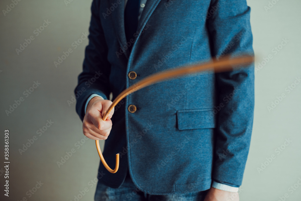 Headmaster with cane. Strict man teacher with crooked rattan cane ...