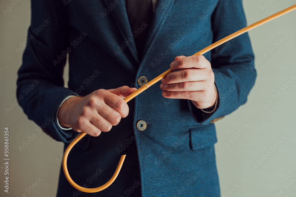 Headmaster with cane. Strict man teacher with crooked rattan cane ...