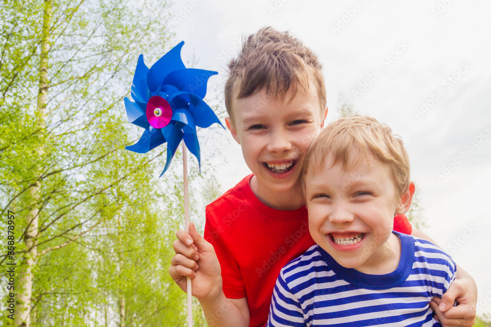 Two European boys in red and blue t-shirts with weather vents in the ...