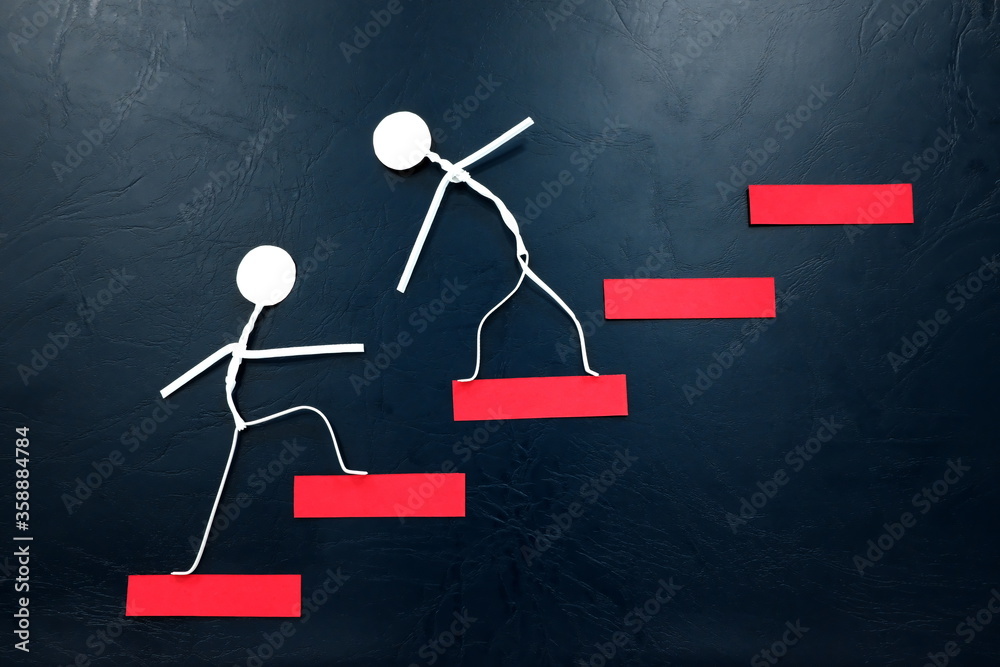 Helping hand, support and teamwork concept. Two human stick figures ...