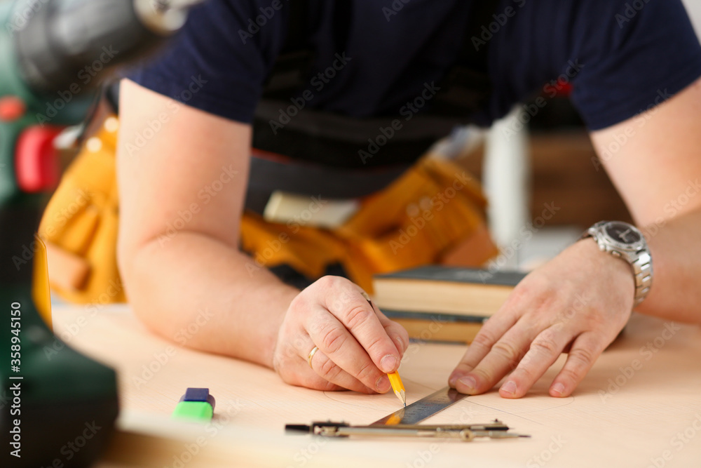 Arms of worker making structure plan on scaled paper closeup. Manual ...