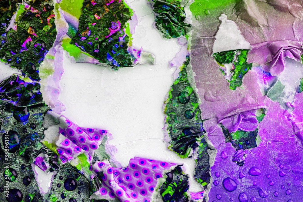 Layers of old wet street posters glued on top of each other, ripped ...