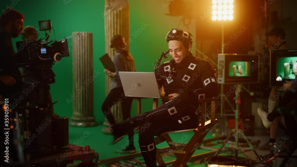 Handsome Smiling Actor Wearing Motion Capture Suit and Head Rig having ...