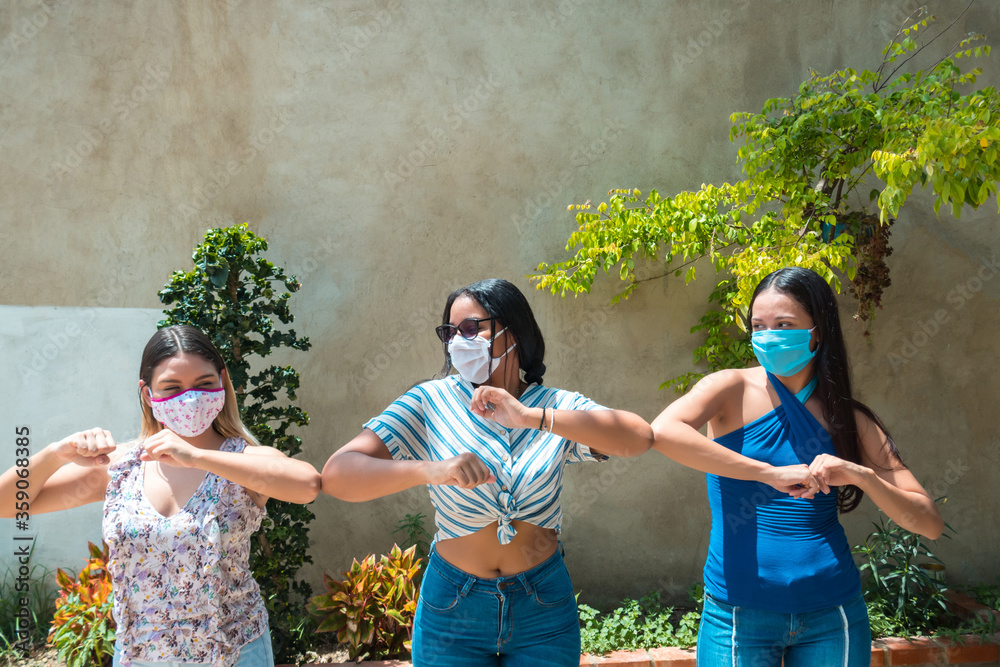 Elbow bumping. Elbow greeting to avoid the spread of coronavirus (COVID ...