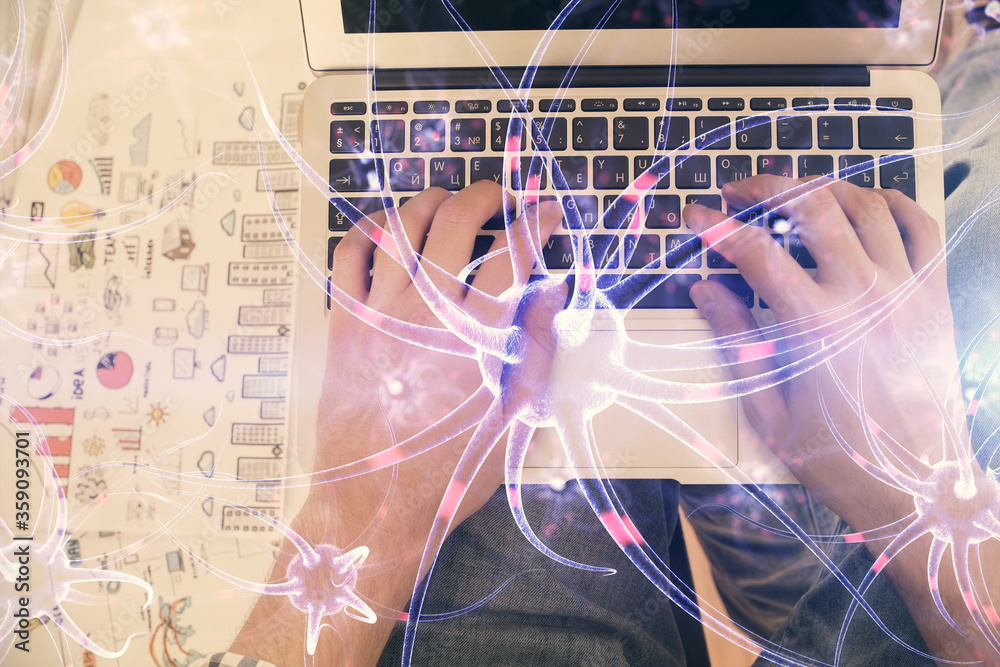 Double exposure of man's hands typing over computer keyboard and neuron ...