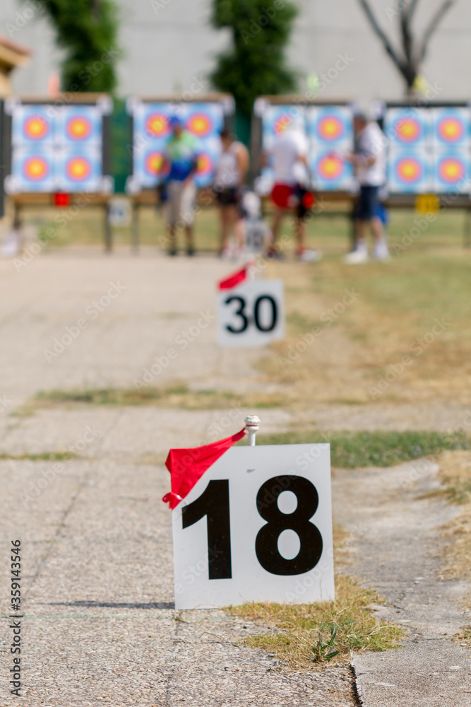 Olympic archery training fieldwith archery target and archers in the ...