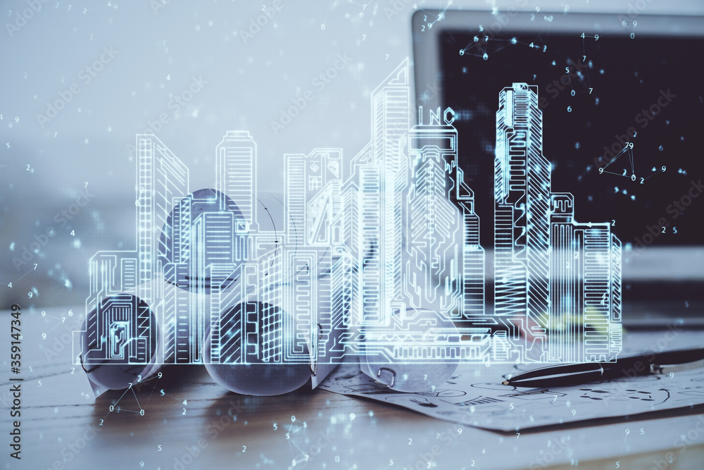 Desktop computer background in office and big town buildings hologram ...