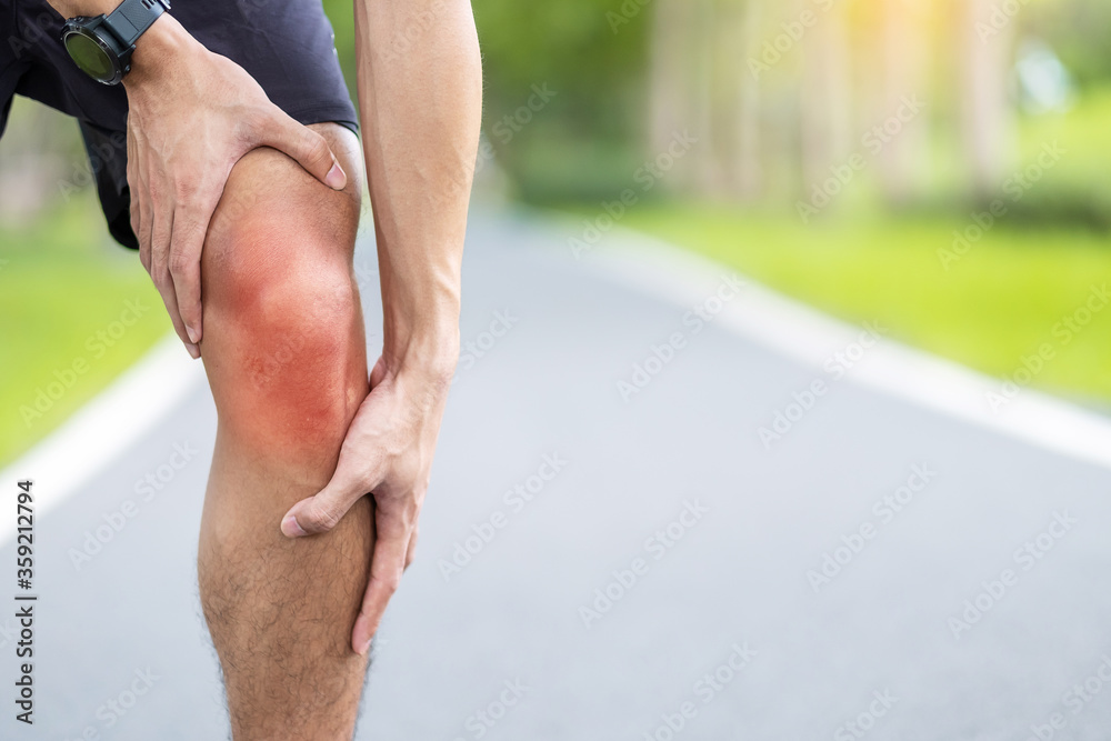 Young adult male with muscle pain during running. runner have knee ache ...