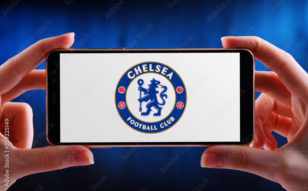 Hands holding smartphone displaying logo of Chelsea FC Stock Photo ...