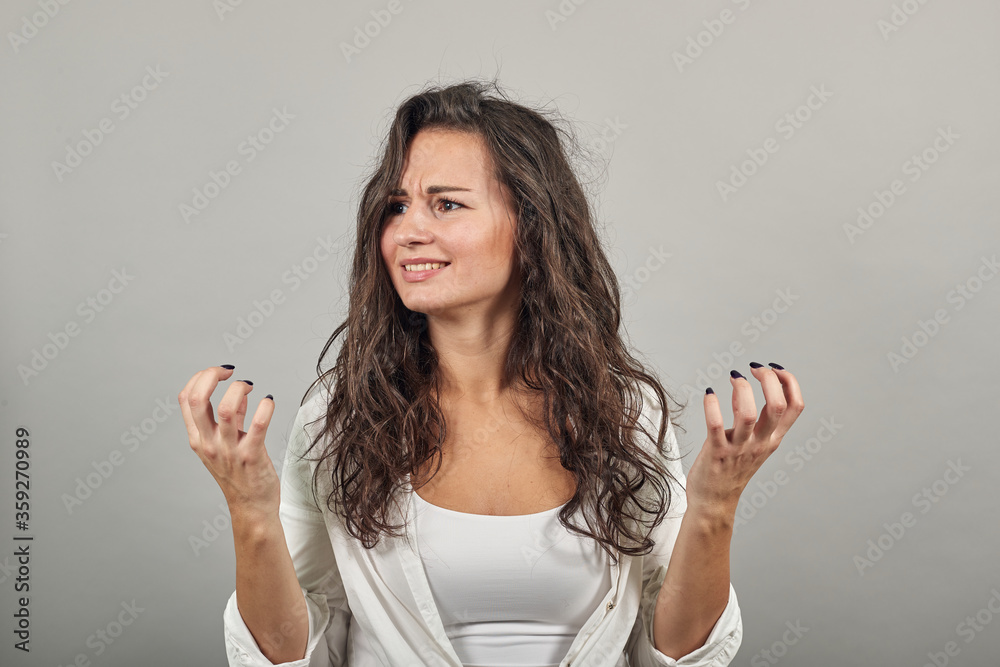 Fingers claw gesture, looks angry hand, shouting, squeez hands in fists ...