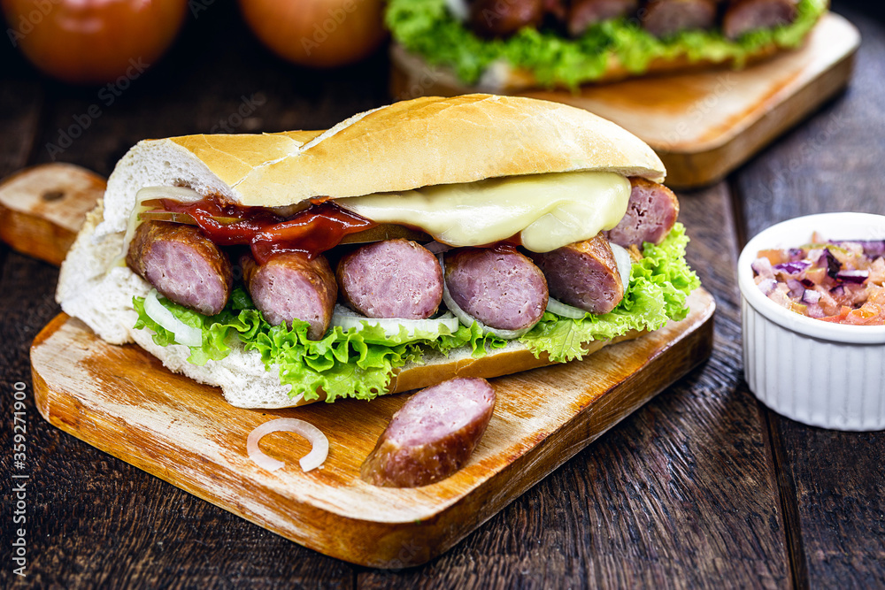 Brazilian beef sandwich, sausage, tomato, lettuce and onion in a salt ...