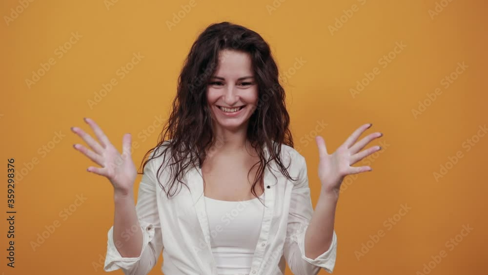 Fingers claw gesture, looks angry hand, shouting, squeez hands in fists ...