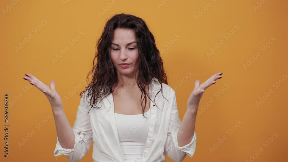 Fingers claw gesture, looks angry hand, shouting, squeez hands in fists ...