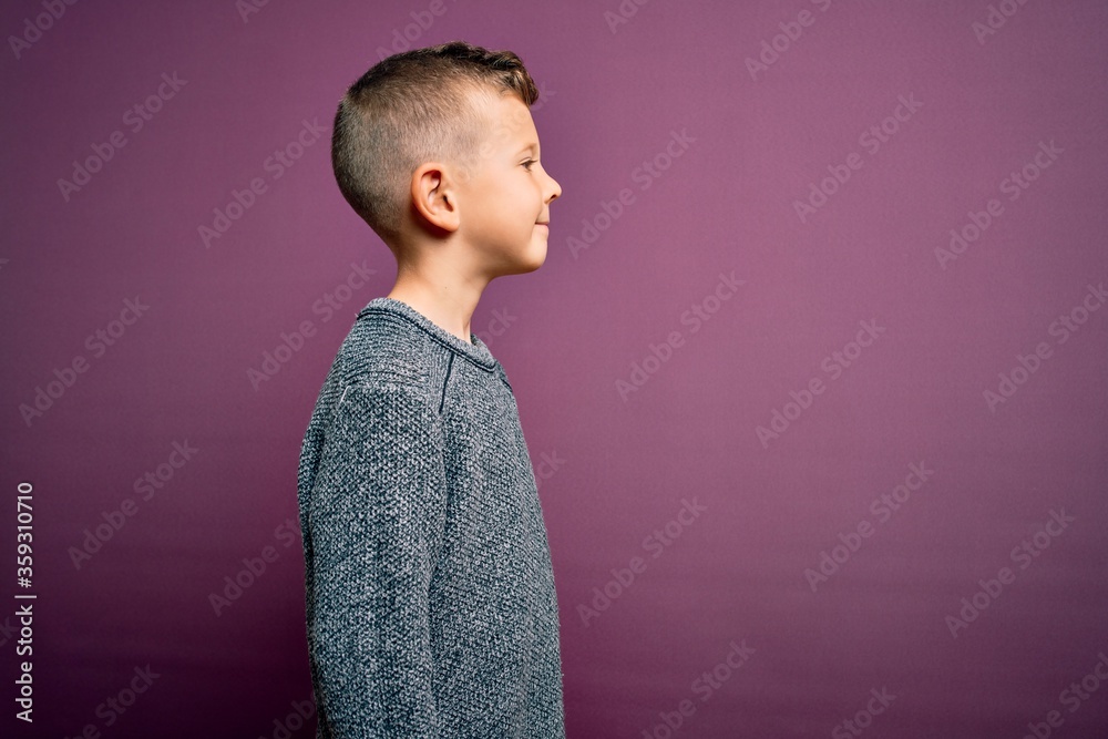 Young little caucasian kid with blue eyes wearing winter sweater ...