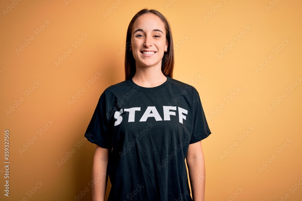 Young beautiful worker woman wearing staff uniform t-shirt over ...