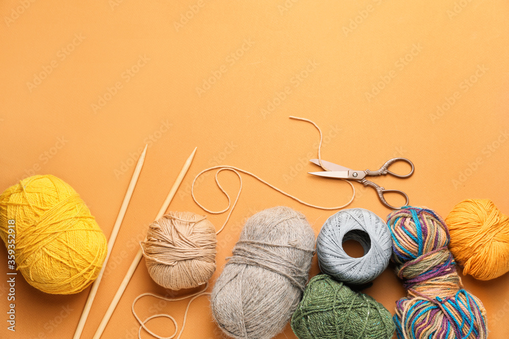 Scissors with knitting yarn and needles on color background Stock Photo ...