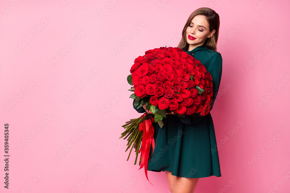 Photo of attractive charming lady hold large red roses bouquet enjoy ...