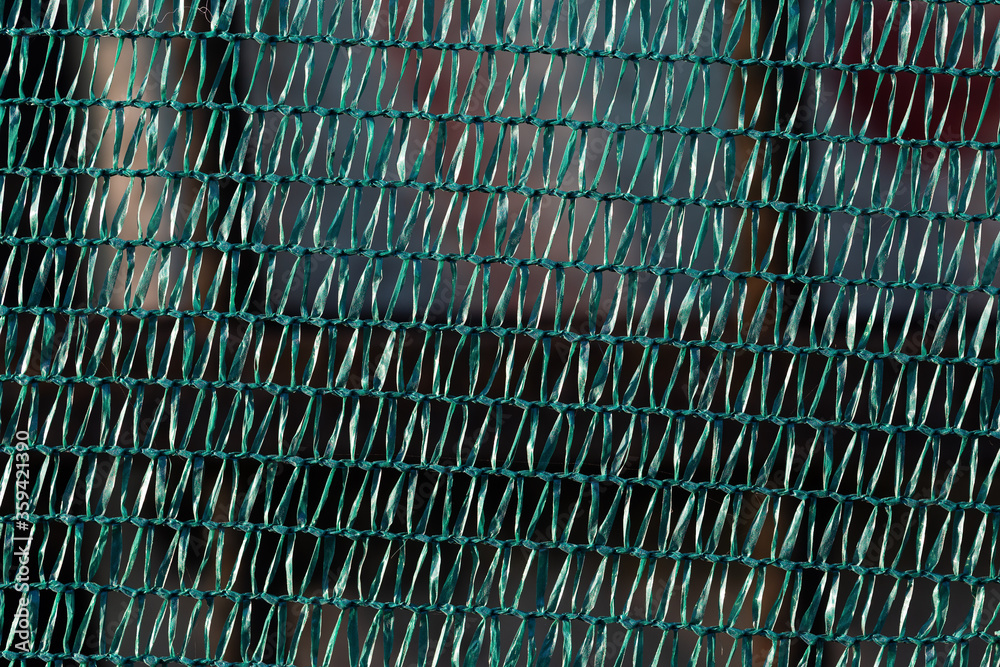 Green synthetic mesh texture. Construction fence made of plastic mesh ...