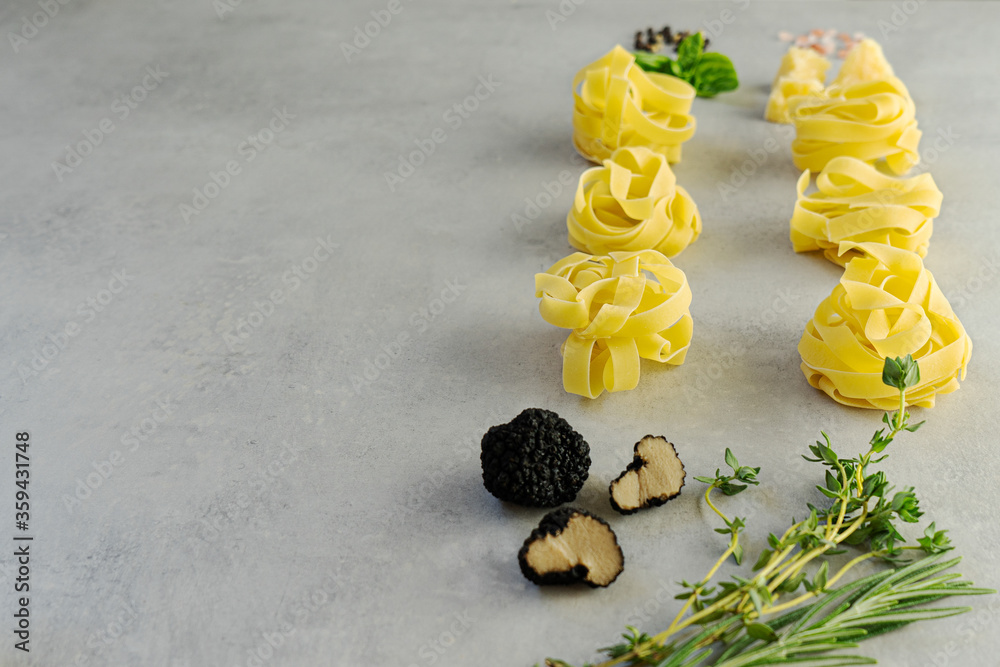 The ingredients for the preparation of fetuccini pasta with black ...