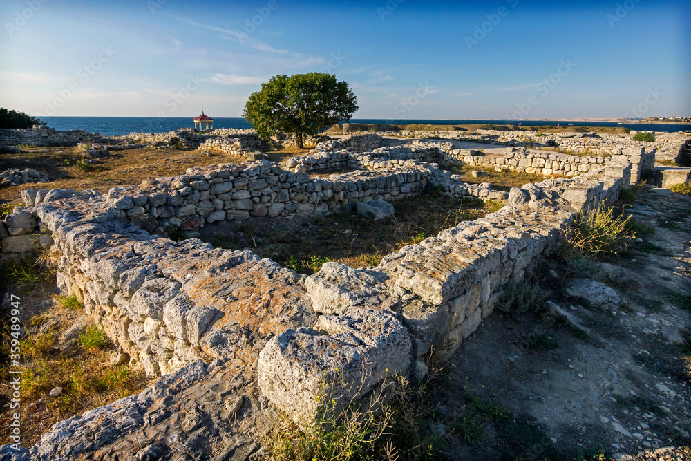 Tauric Chersonesus. Ruins of an ancient city on the beach at sunset ...