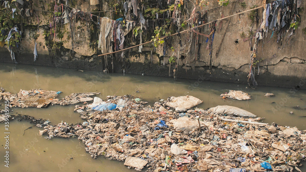 Dirty river in Dharavi slums. Mumbai. India. Stock Photo | Adobe Stock