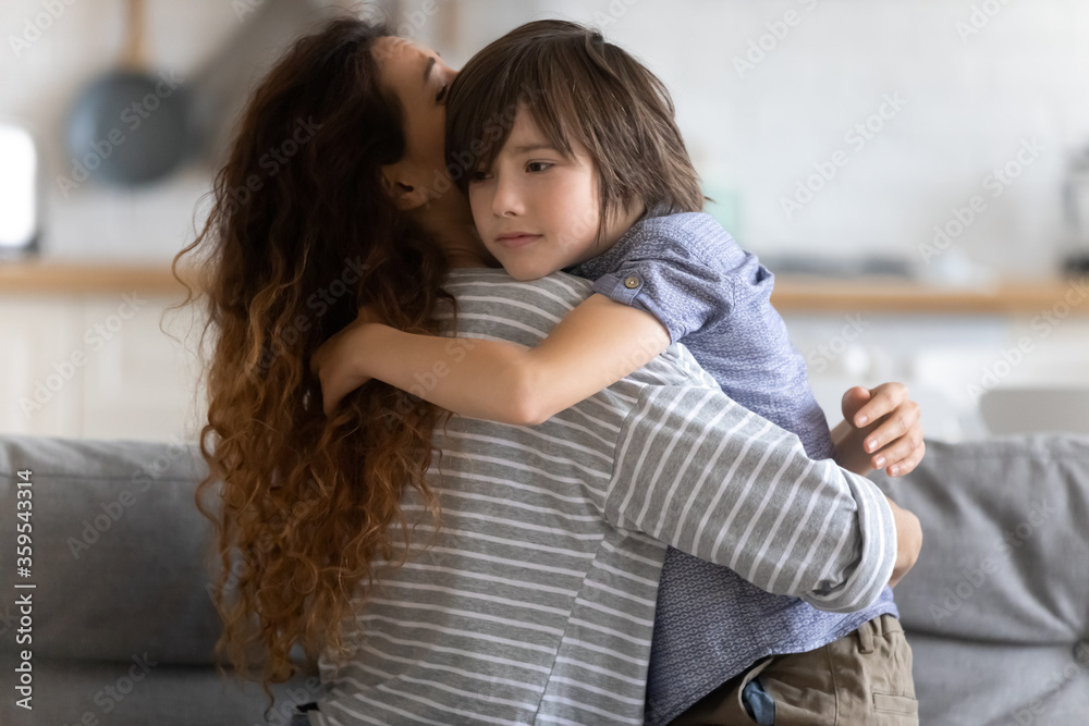Close up caring young mother hugging preschool upset son. Lovely mom ...